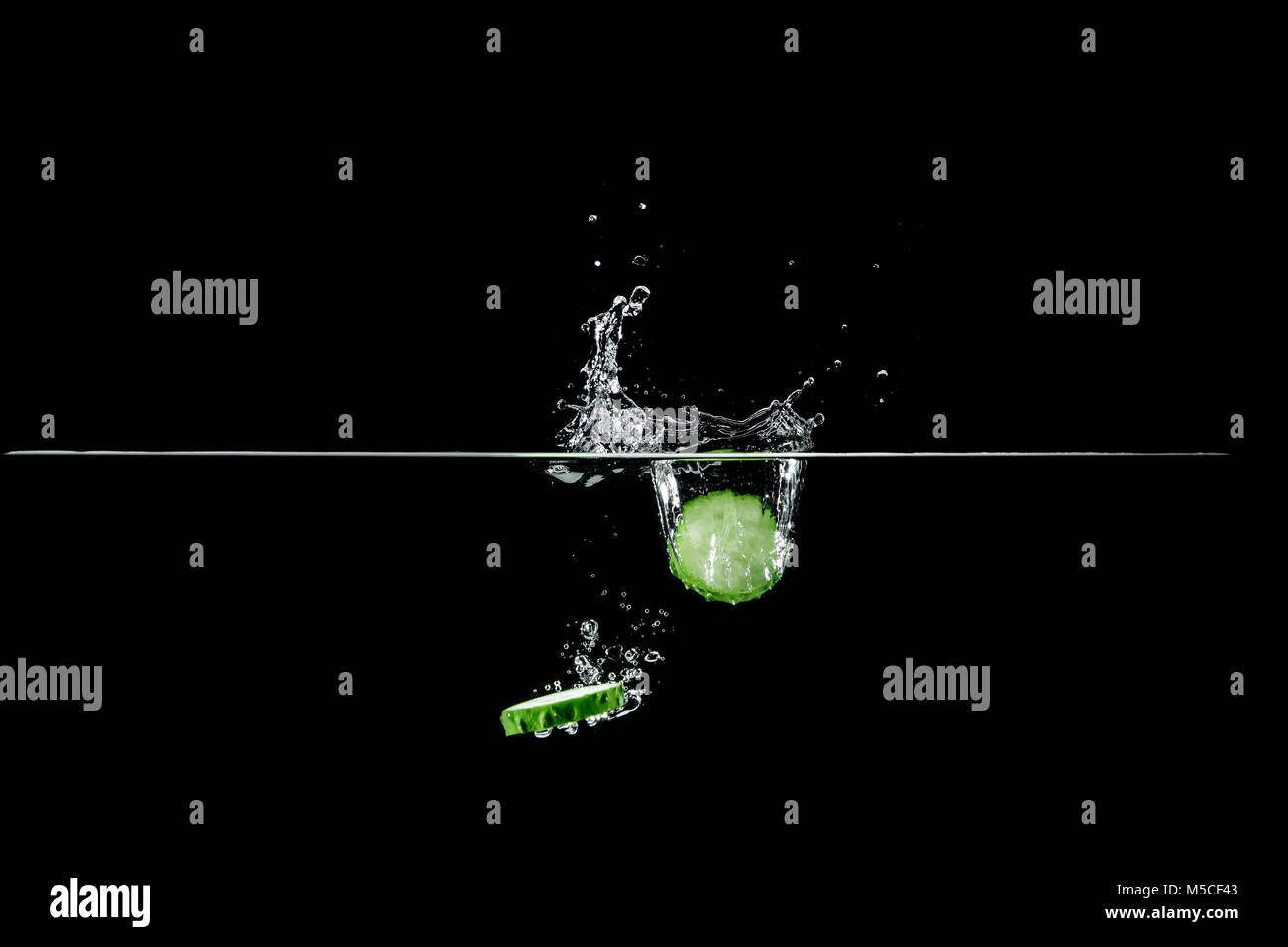 Cucumber slices splash hi-res stock photography and images - Alamy