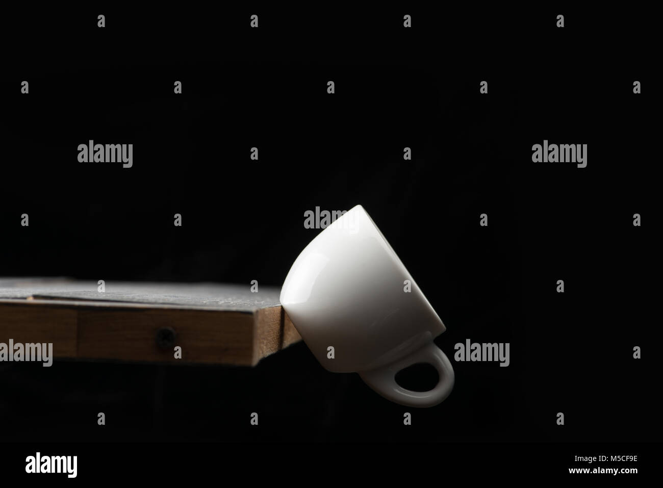 A falling cup of coffee Stock Photo - Alamy