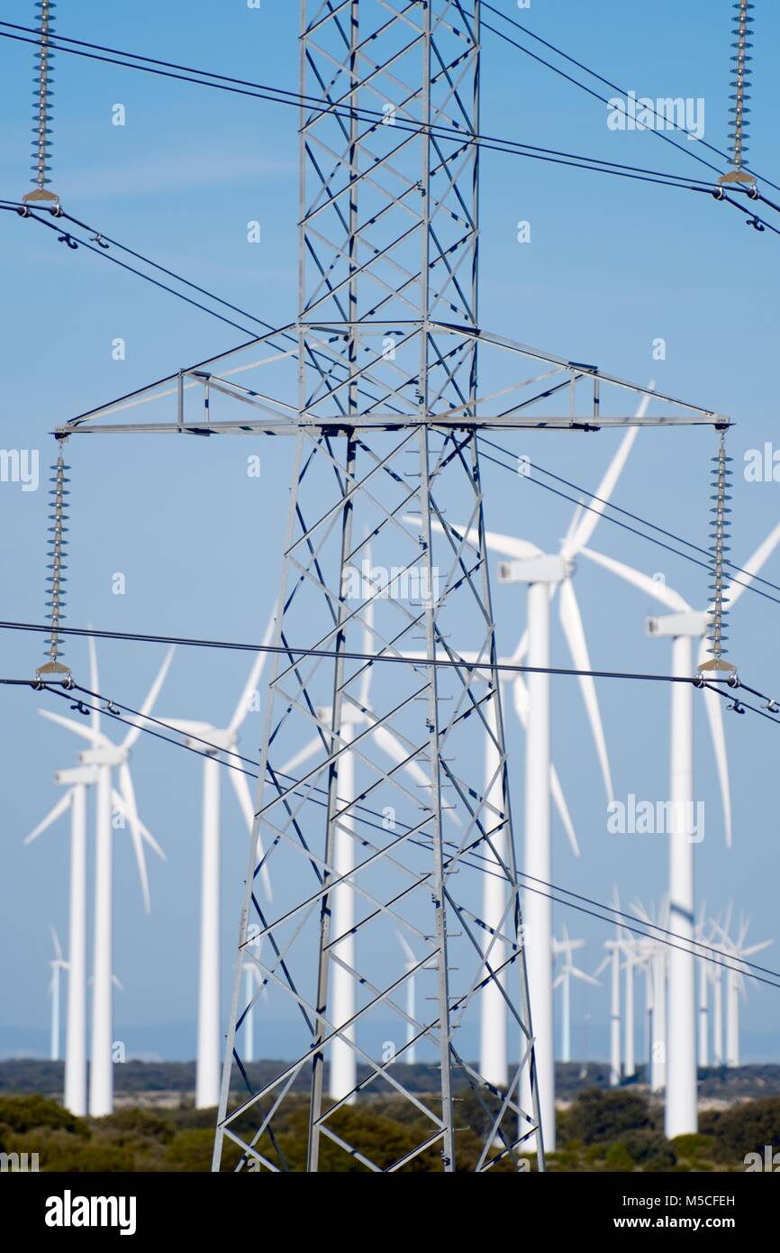 windmills for removable energy production and pylon Stock Photo - Alamy