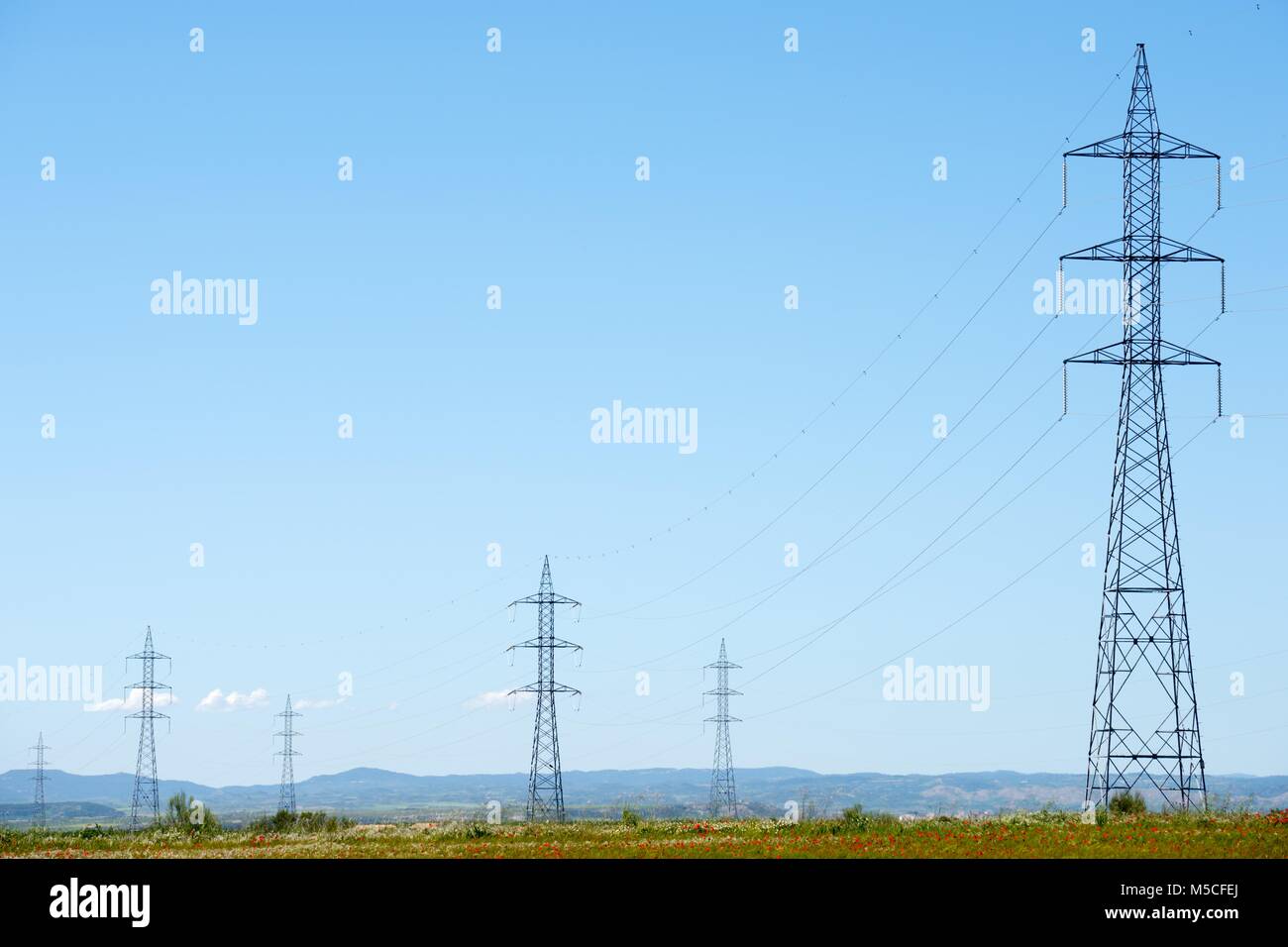 close up of a high voltage tower with blue sky Stock Photo - Alamy