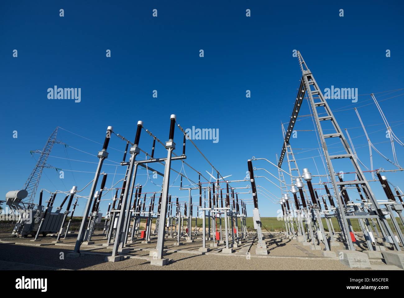 Electrical substation with blue and clear sky Stock Photo - Alamy