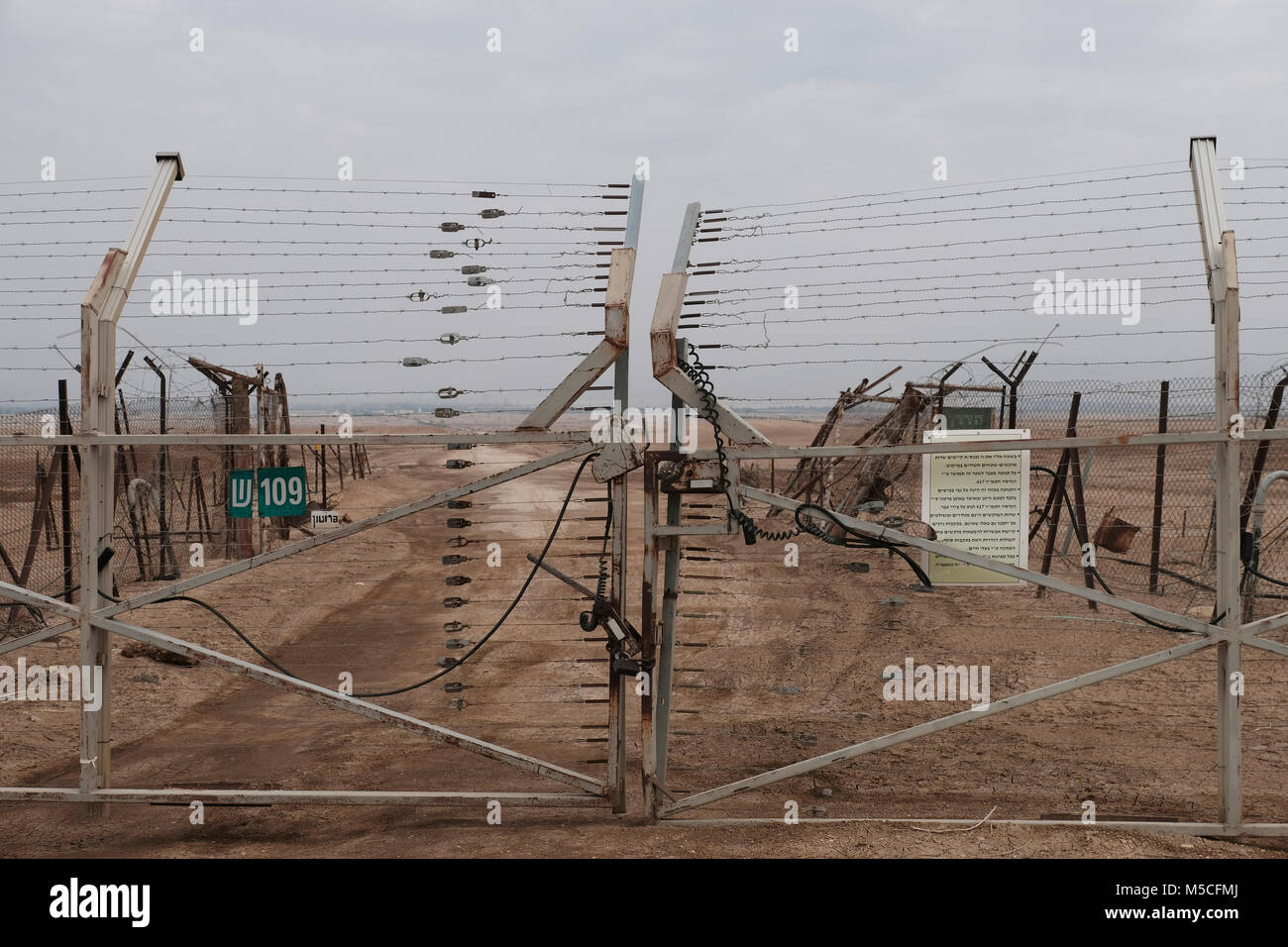 A closed gate in the border fence with Jordan near Jericho in the ...