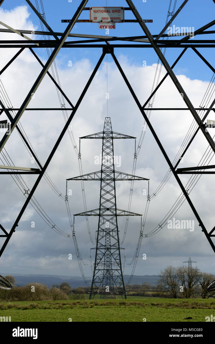 Electricity pylons crossing the countryside in Carmarthenshire, west ...