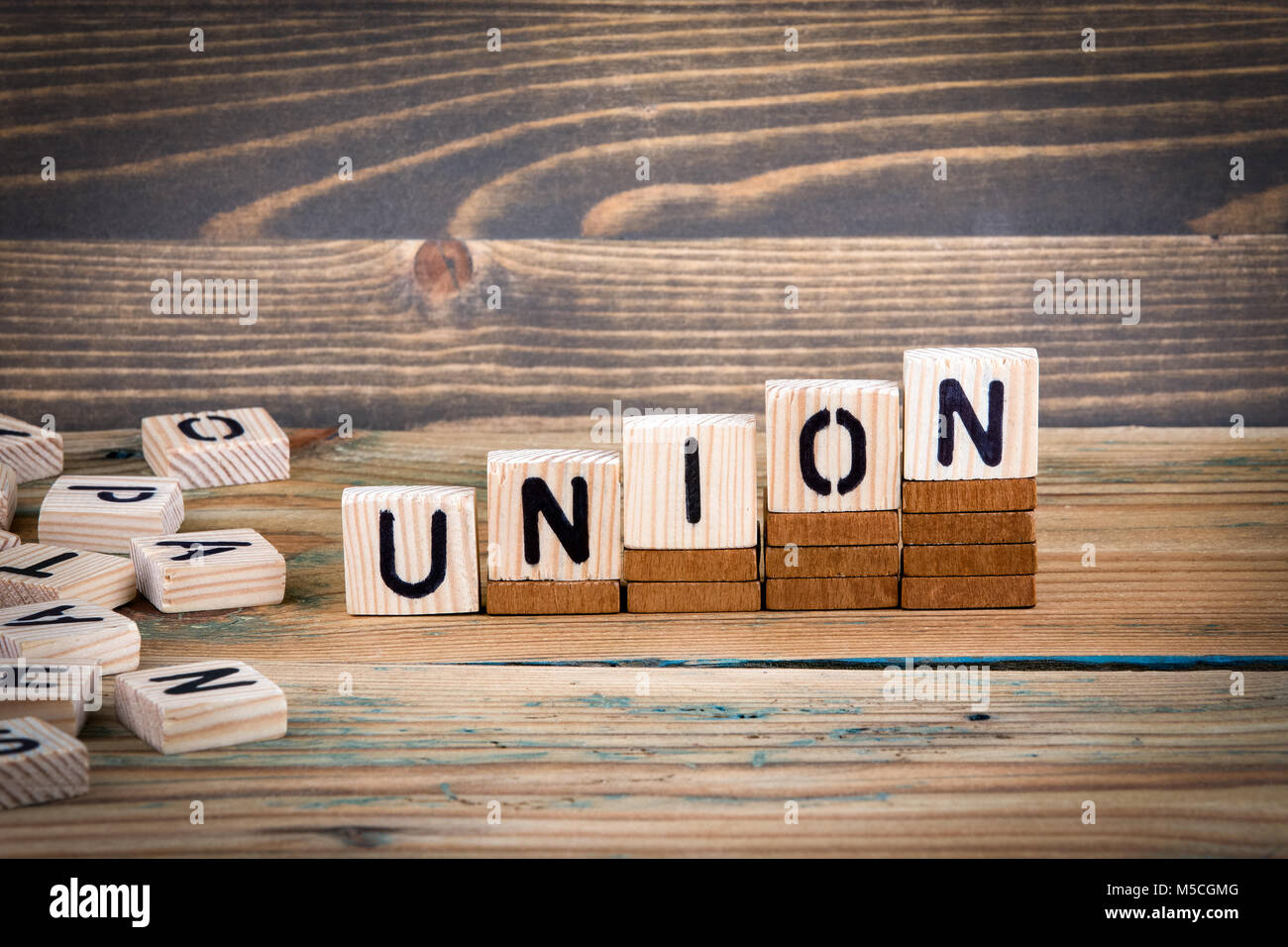 Union. Wooden letters on the office desk, informative and communication ...