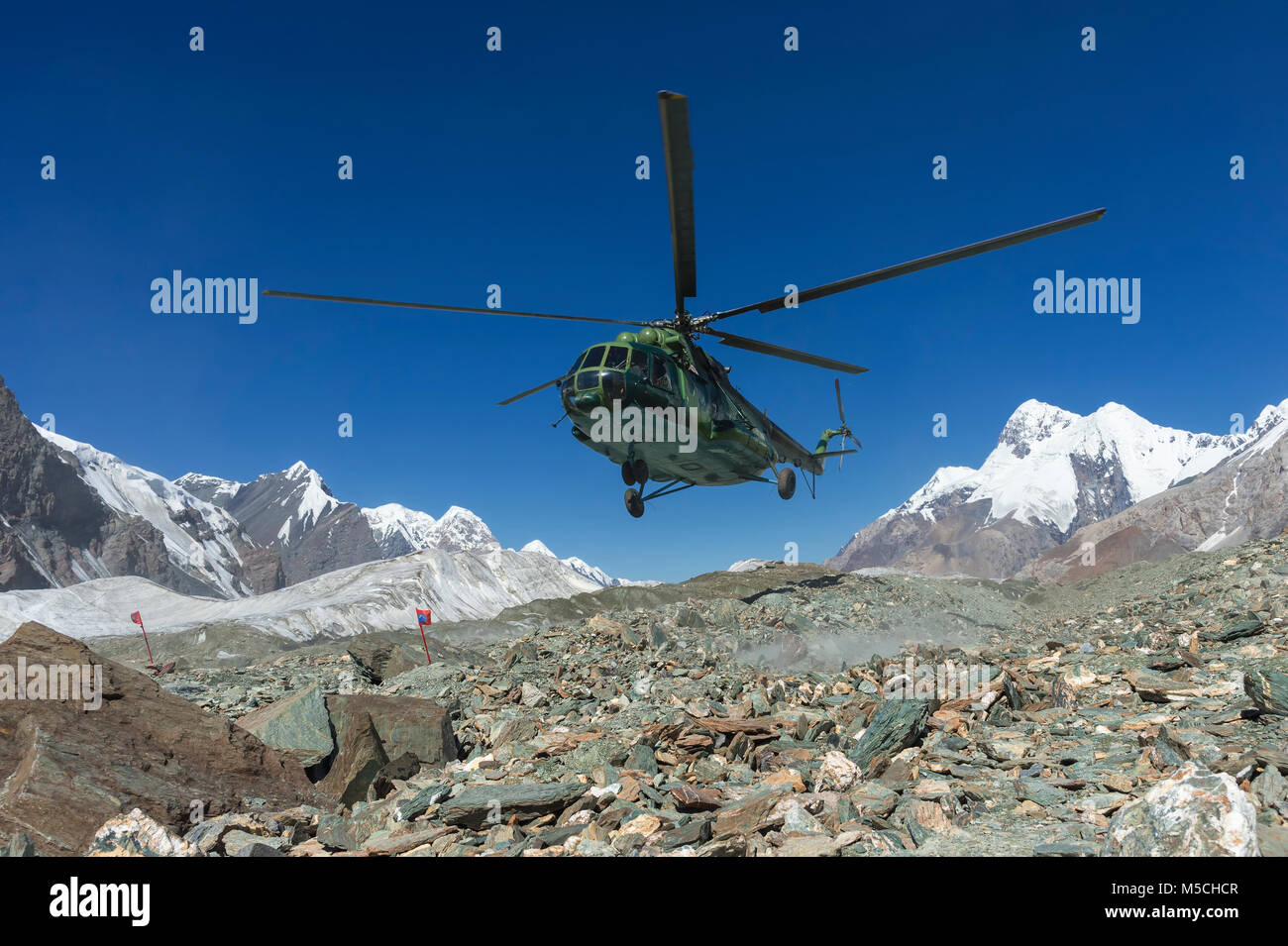 Helicopter landing at the Khan Tengri Base Camp, Central Tian Shan ...