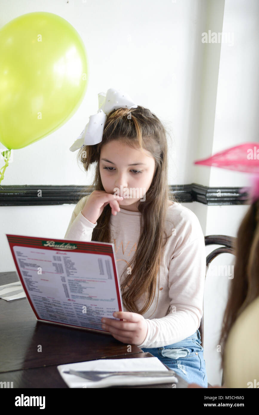 A child orders from a cafe menu at a birthday party Stock Photo - Alamy
