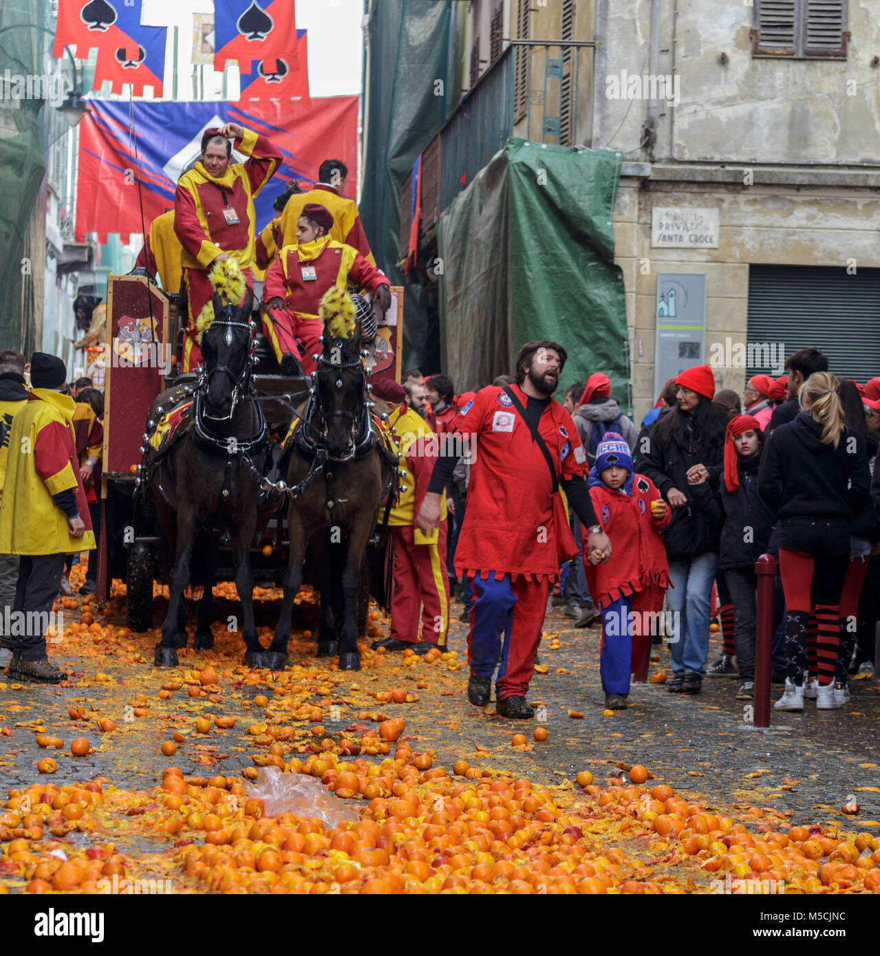 IVREA, ITALY - 11 FEBRUARY 2018: participants of the orange battle ...