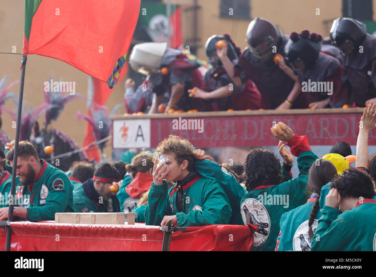 IVREA, ITALY - 11 FEBRUARY 2018: participants of the orange battle ...