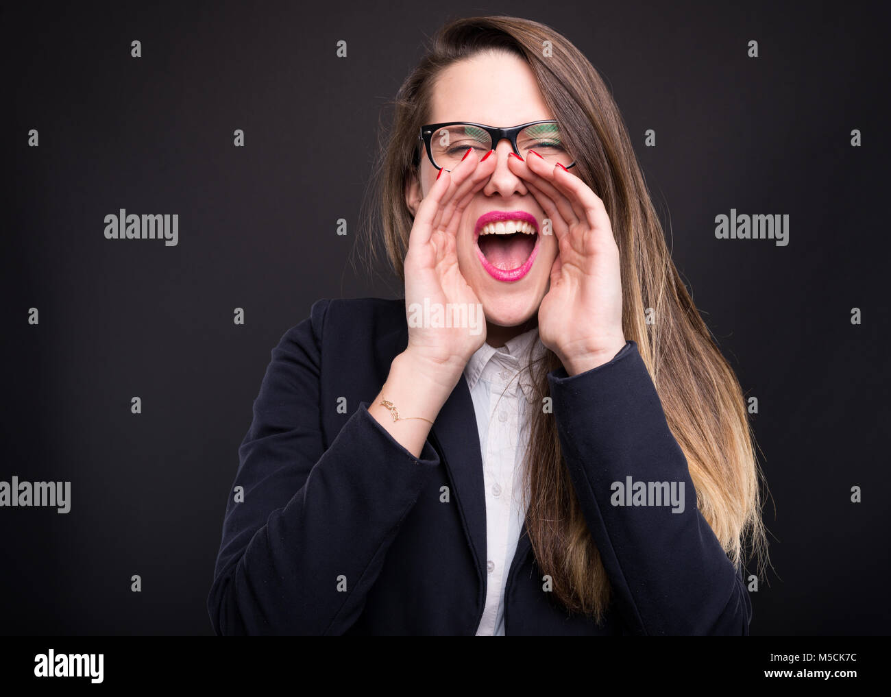 Pretty business woman or entrepreneur loud screaming or calling out to ...