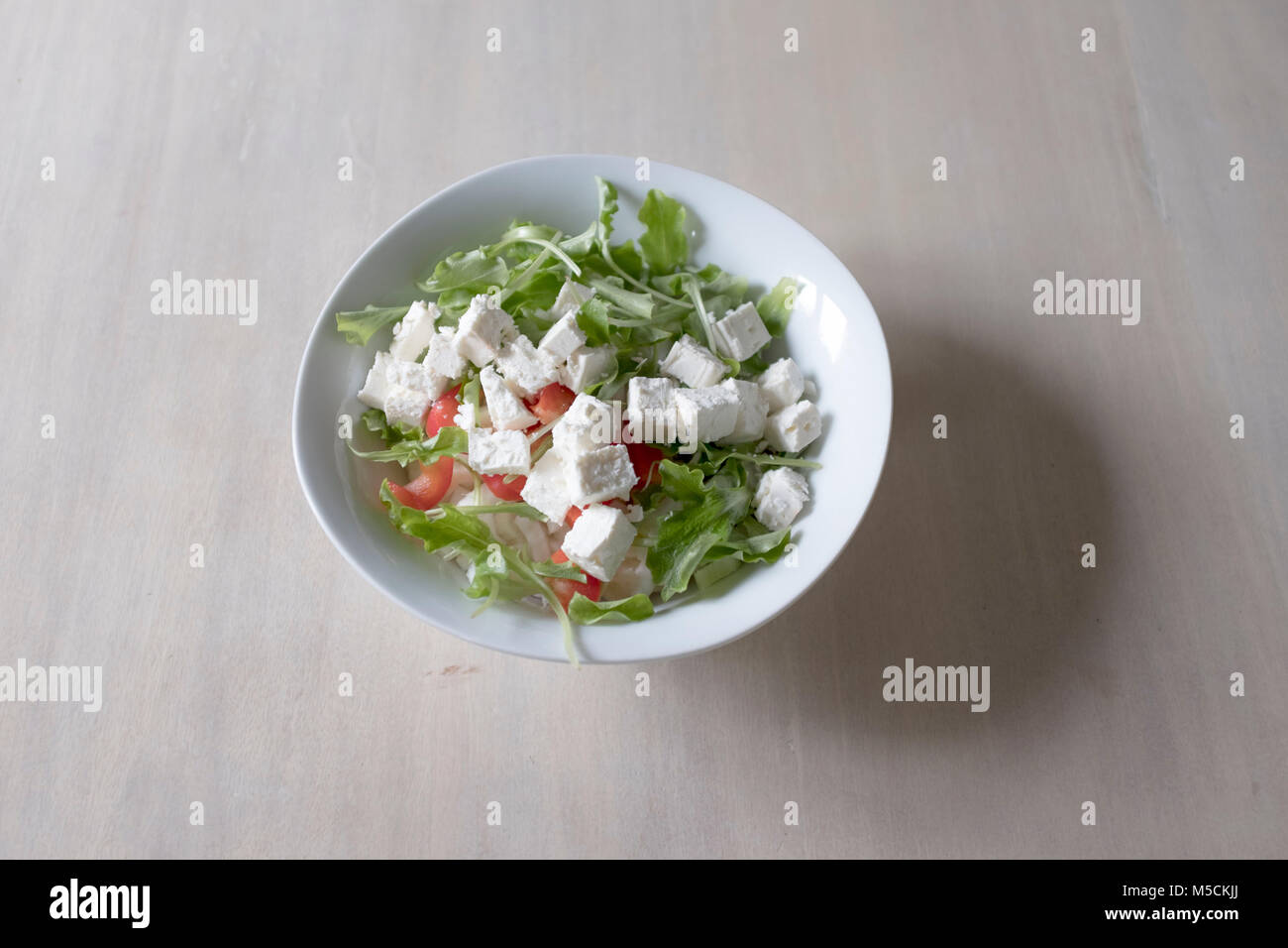 series of pictures showing different stages of preparation of a salad ...