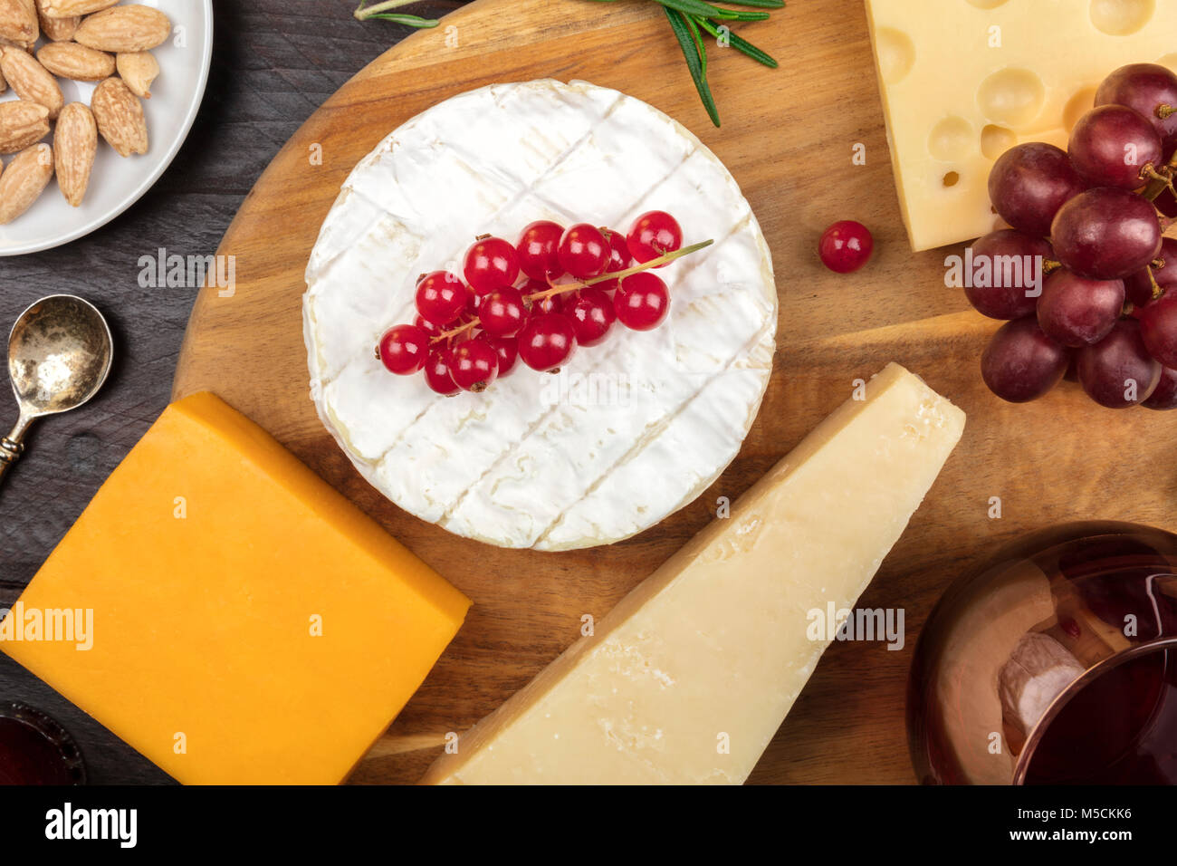 Closeup of various types of cheese on rustic background Stock Photo - Alamy