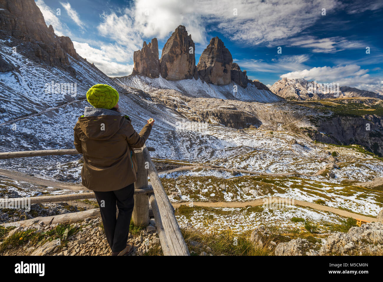 Explorer searching direction with compass in summer mountains, point of ...