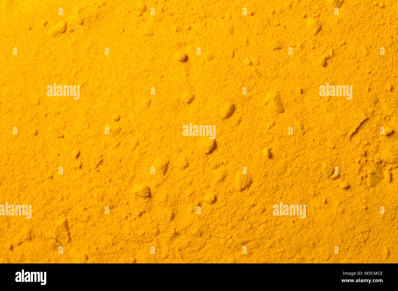 Yellow turmeric/curcuma powder texture, top view closeup photo on ...