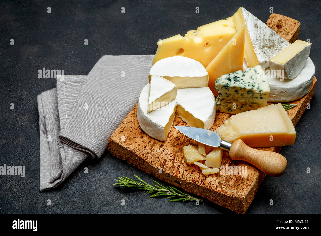 Various types of cheese - parmesan, brie, roquefort, cheddar Stock ...