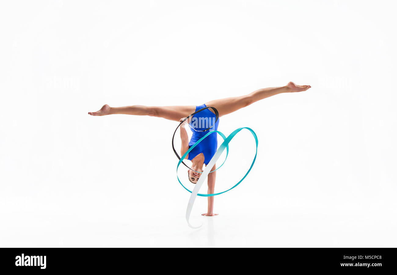 The portrait of beautiful woman gymnast on white Stock Photo - Alamy