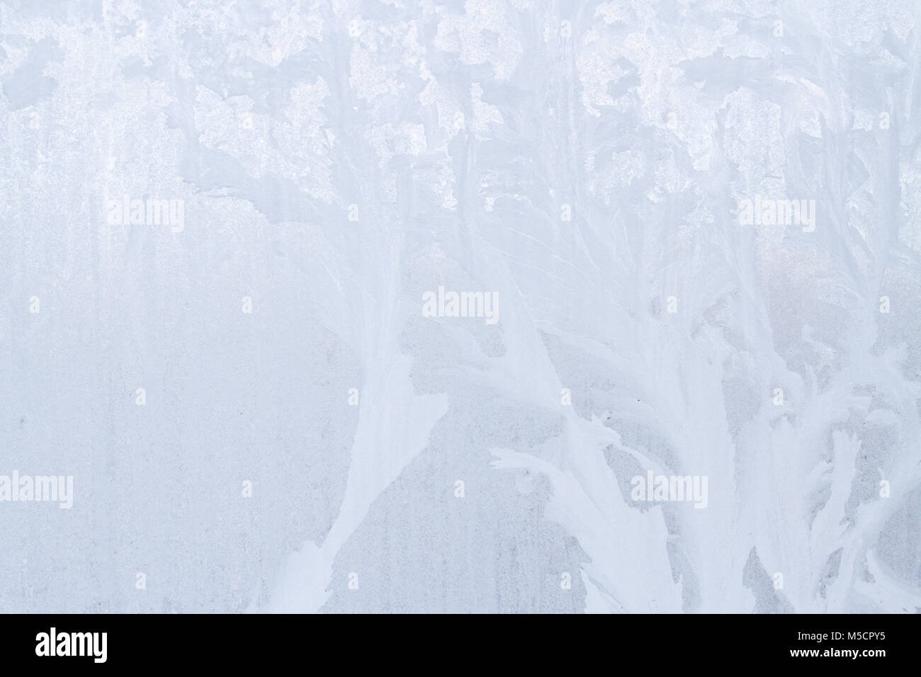 Winter frosty patterns on the frozen ice window Stock Photo - Alamy