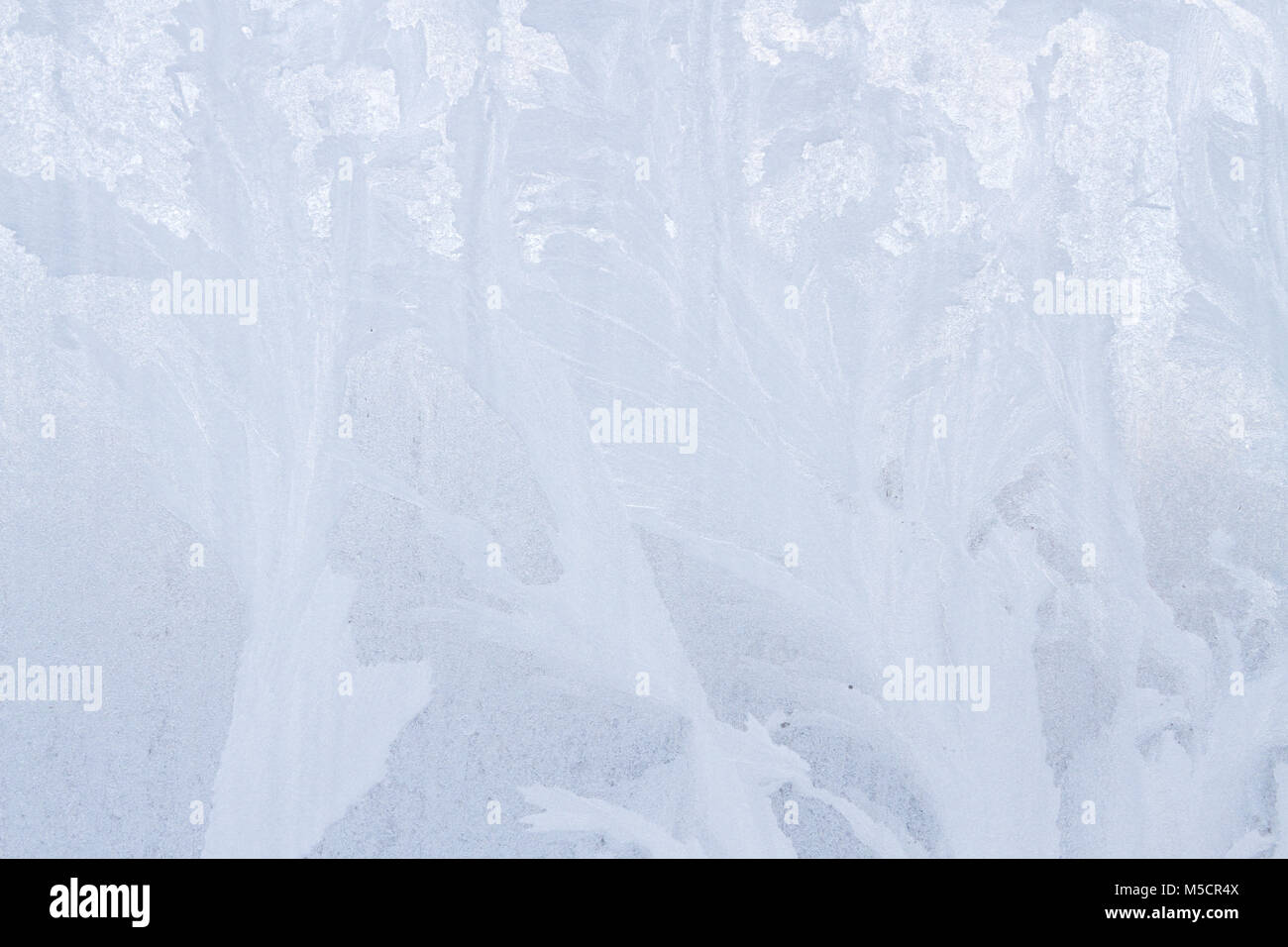 Winter frosty patterns on the frozen ice window Stock Photo - Alamy