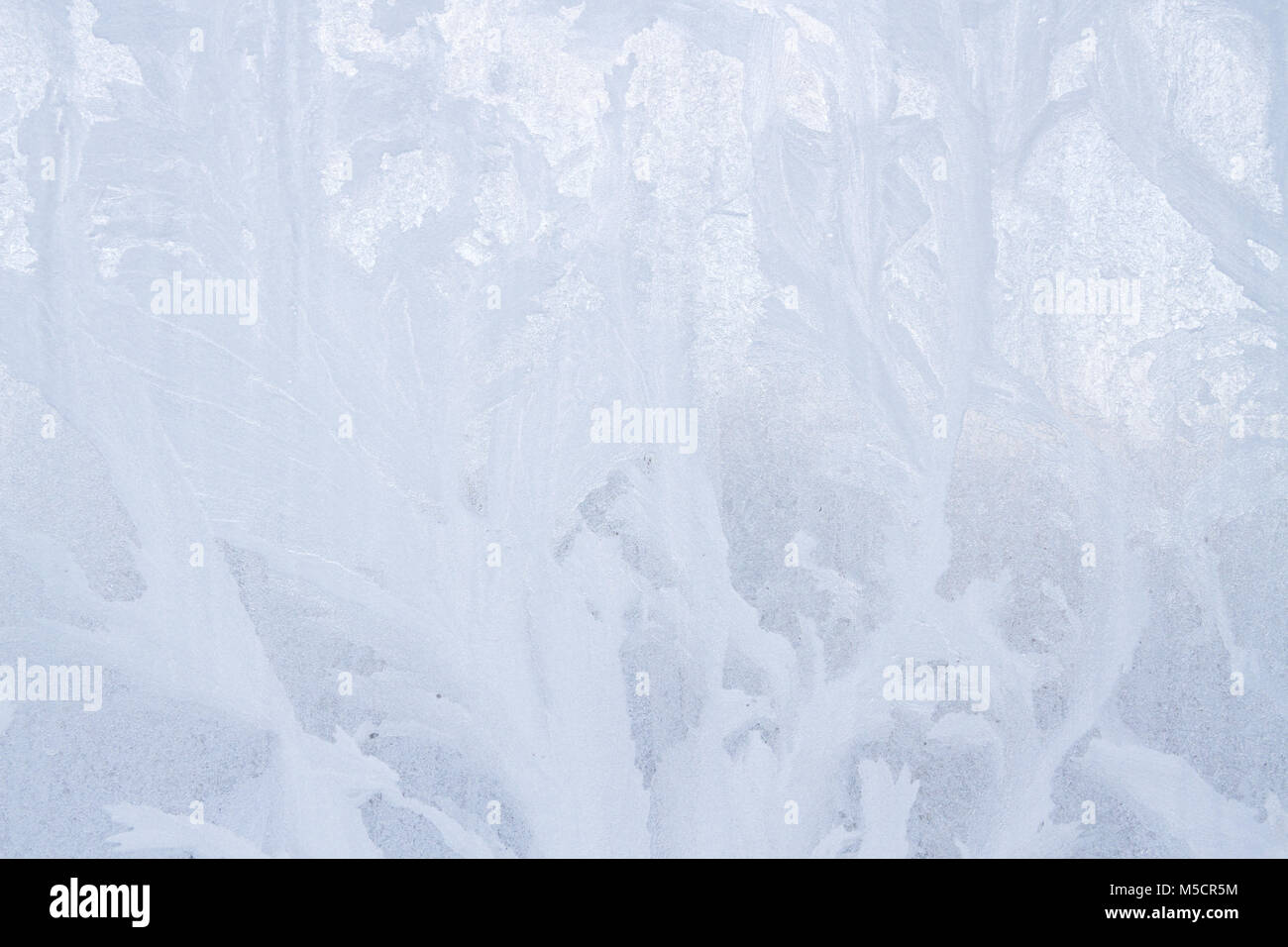 Winter frosty patterns on the frozen ice window Stock Photo - Alamy