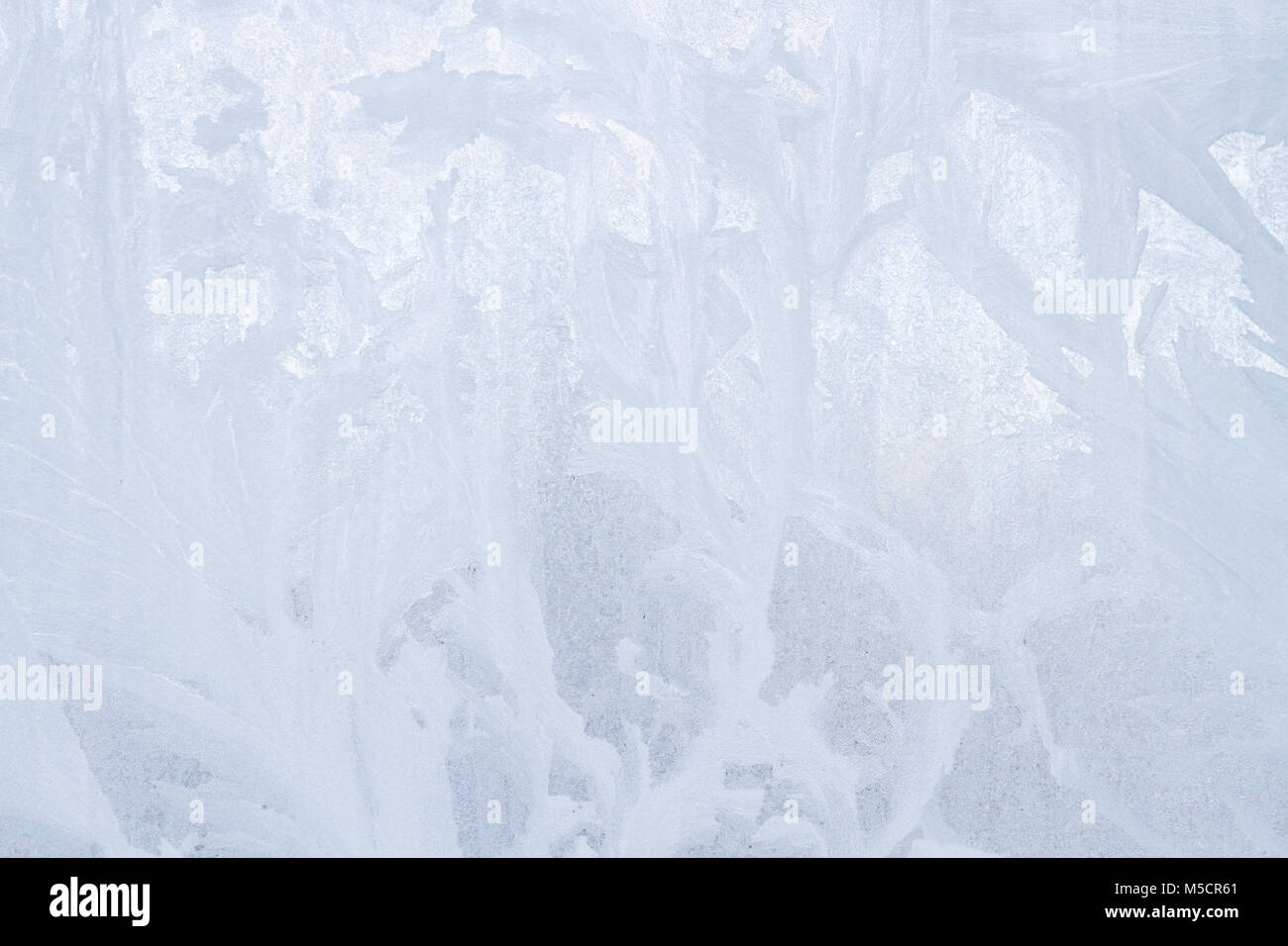 Winter frosty patterns on the frozen ice window Stock Photo - Alamy