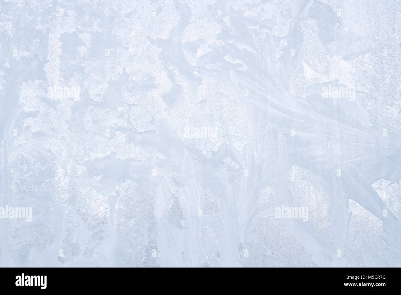 Winter frosty patterns on the frozen ice window Stock Photo - Alamy