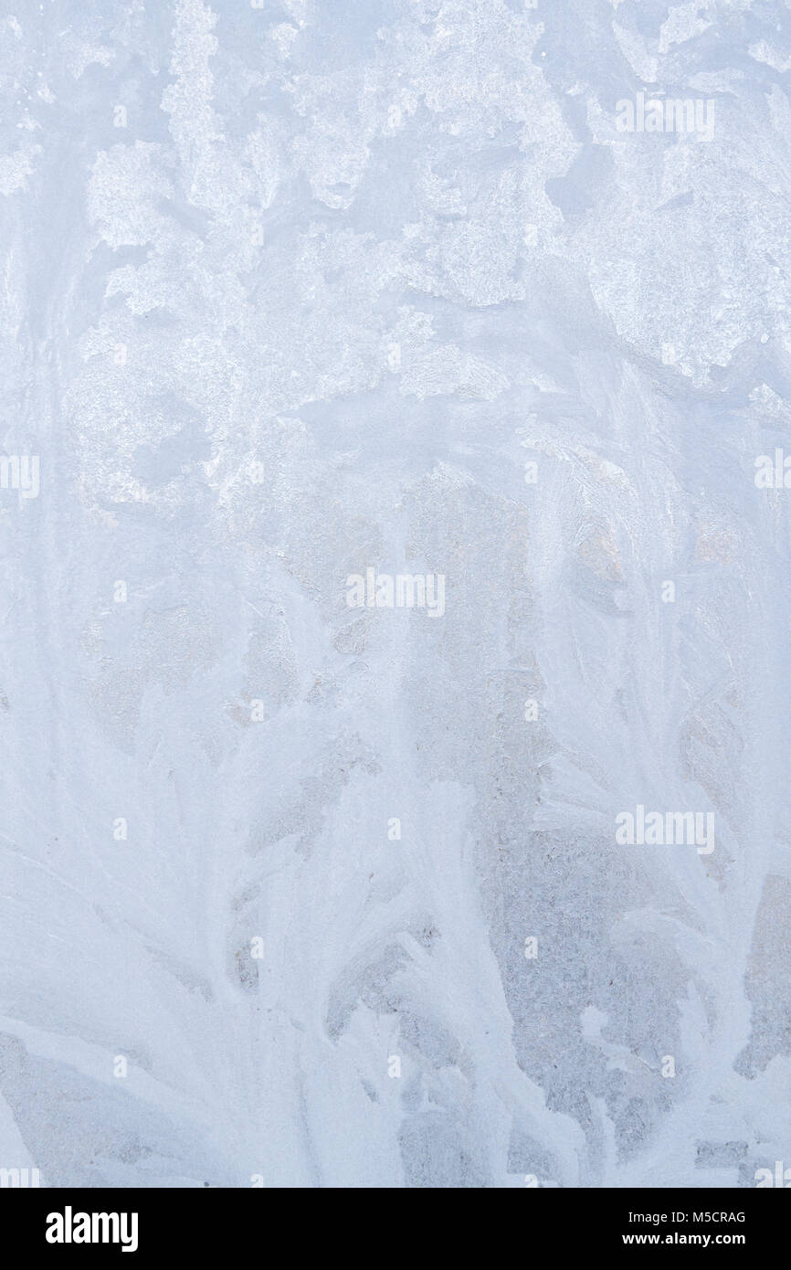 Winter frosty patterns on the frozen ice window Stock Photo - Alamy
