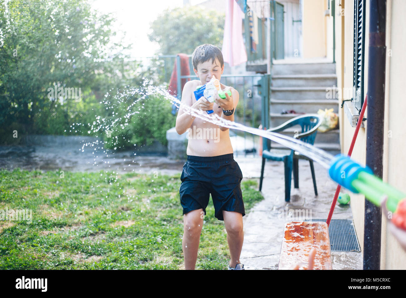 Children And Water Guns High Resolution Stock Photography and Images ...