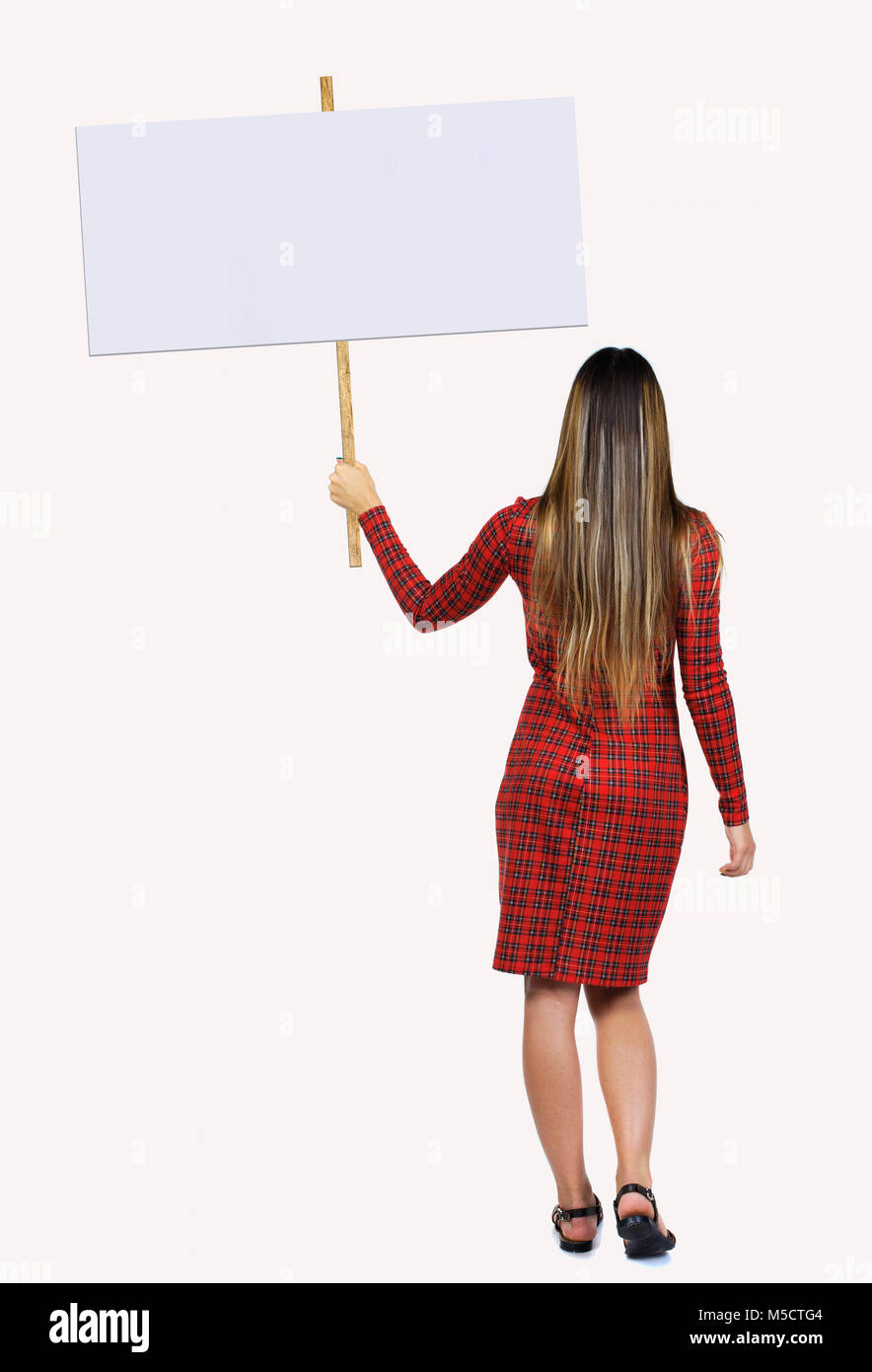Back view woman showing sign board. man holds information plate. Rear ...