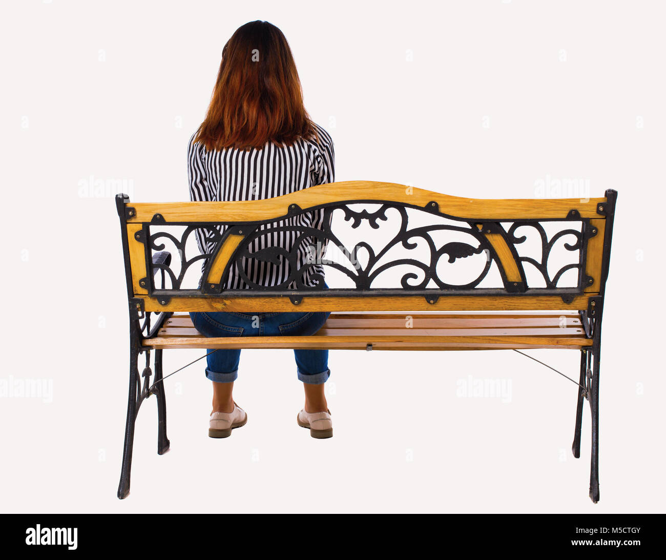 Back view of a woman sitting on a bench. girl watching. Rear view ...