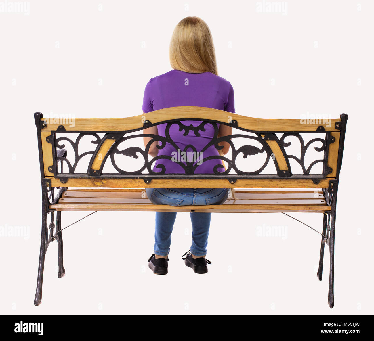 Back view of a woman sitting on a bench. girl watching. Rear view ...