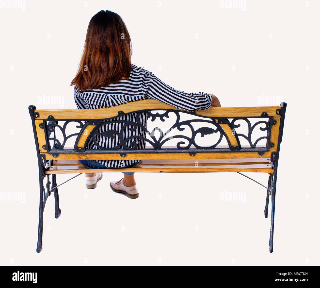 Back view of a woman sitting on a bench. girl watching. Rear view ...