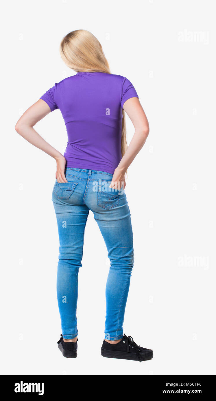 back view of standing young beautiful woman. girl watching. Rear view ...