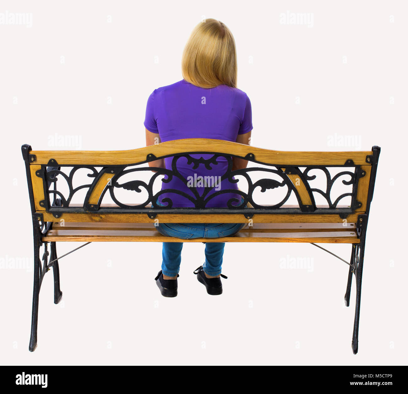 Back view of a woman sitting on a bench. girl watching. Rear view ...