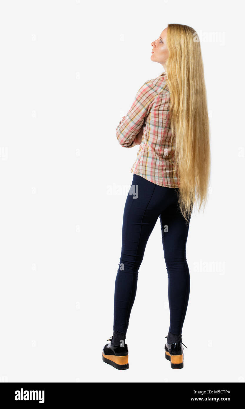 back view of standing young beautiful woman. girl watching. Rear view ...