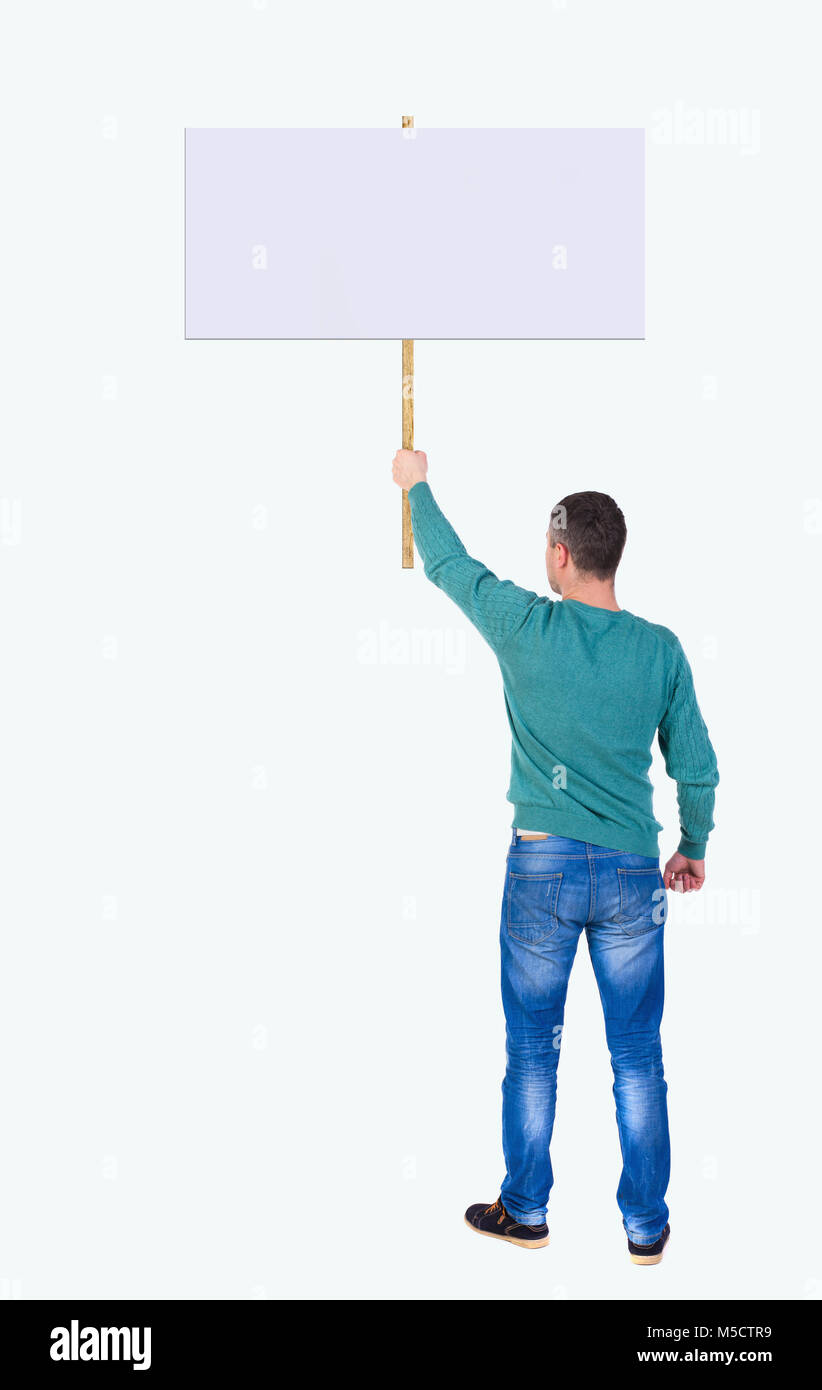 Back view man showing sign board. man holds information plate. Rear ...