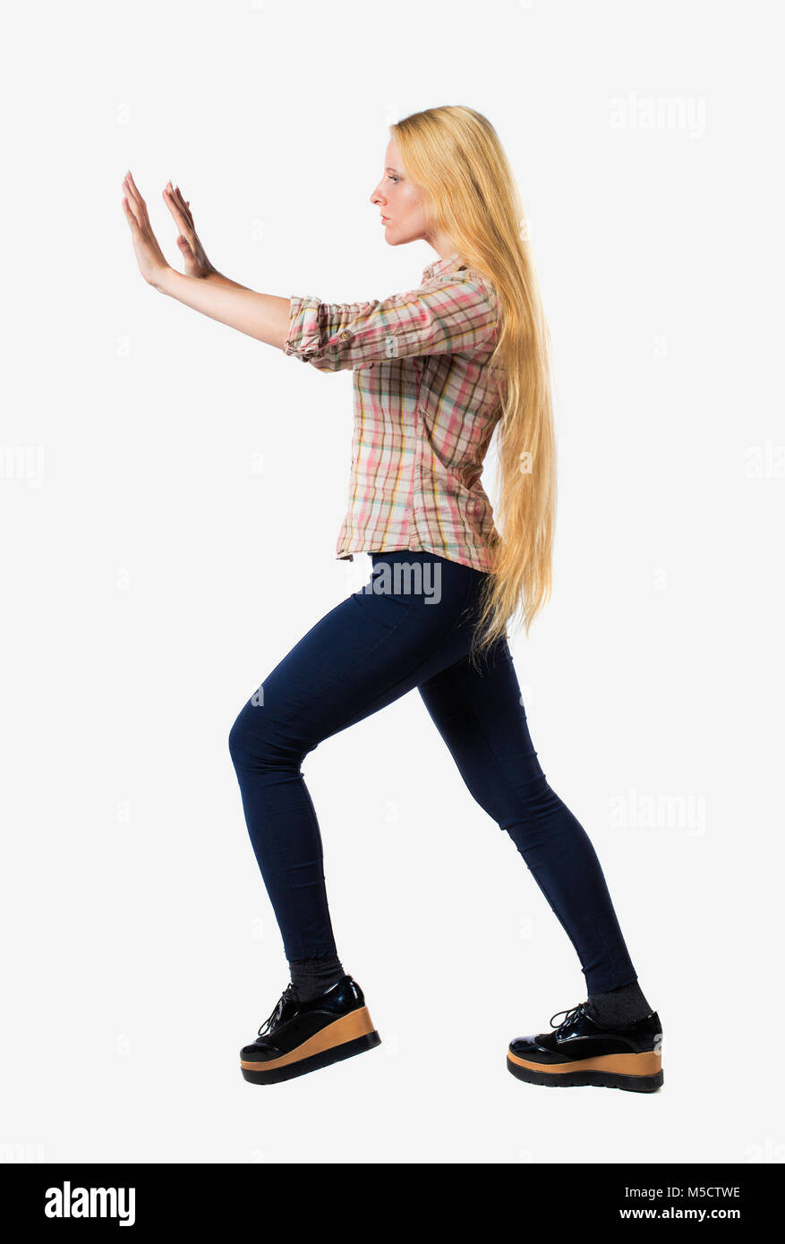 back view of woman pushes wall. Isolated over white background. Rear ...