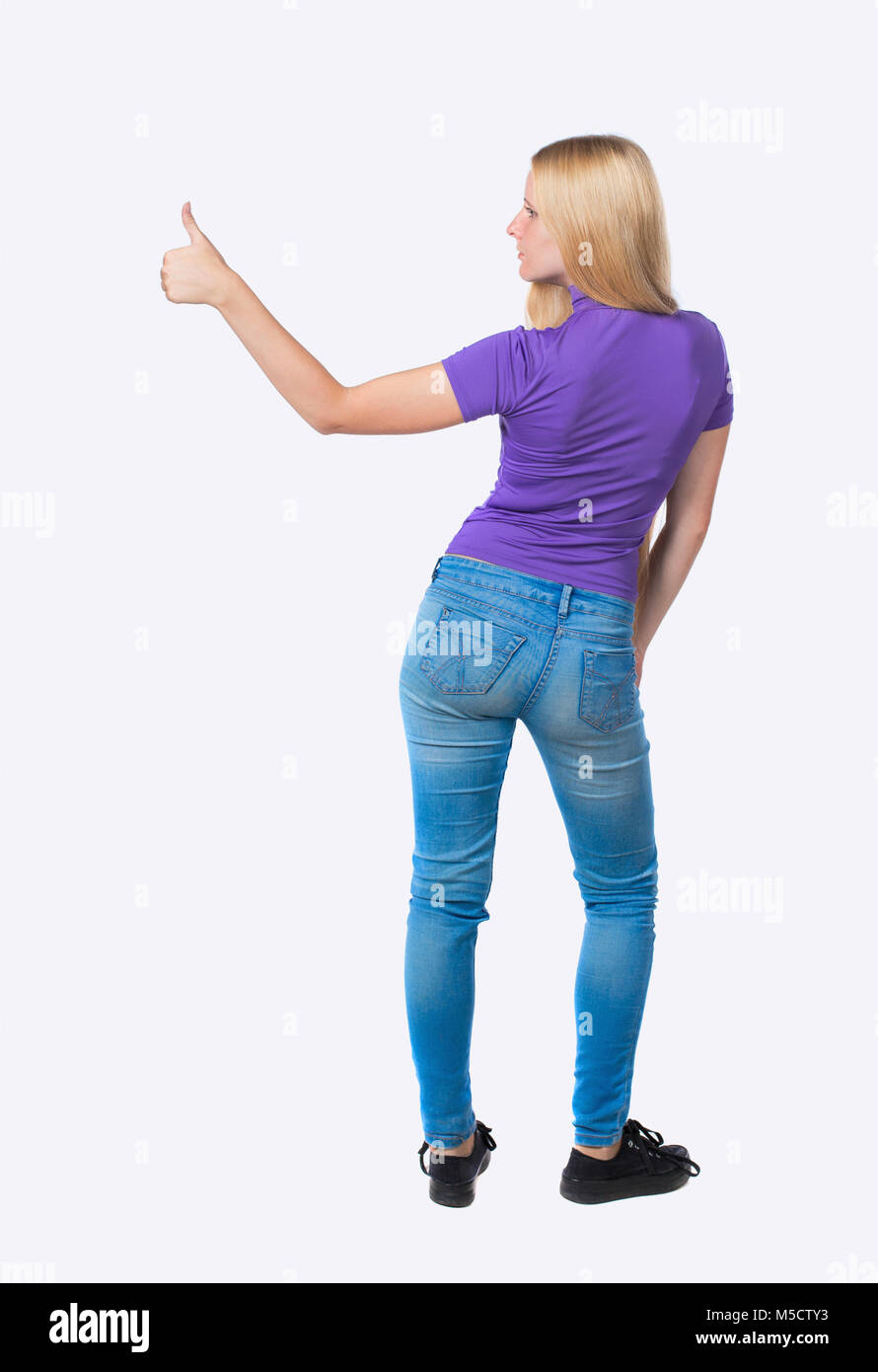 Back view of woman thumbs up. Rear view people collection. backside ...