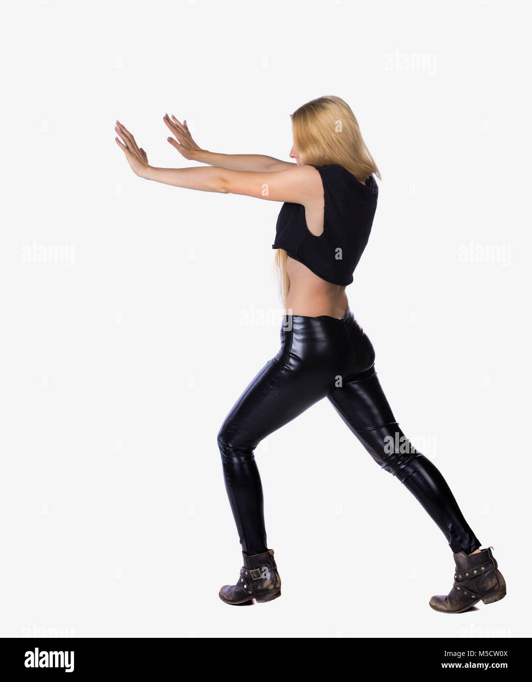 back view of woman pushes wall. Isolated over white background. Rear ...