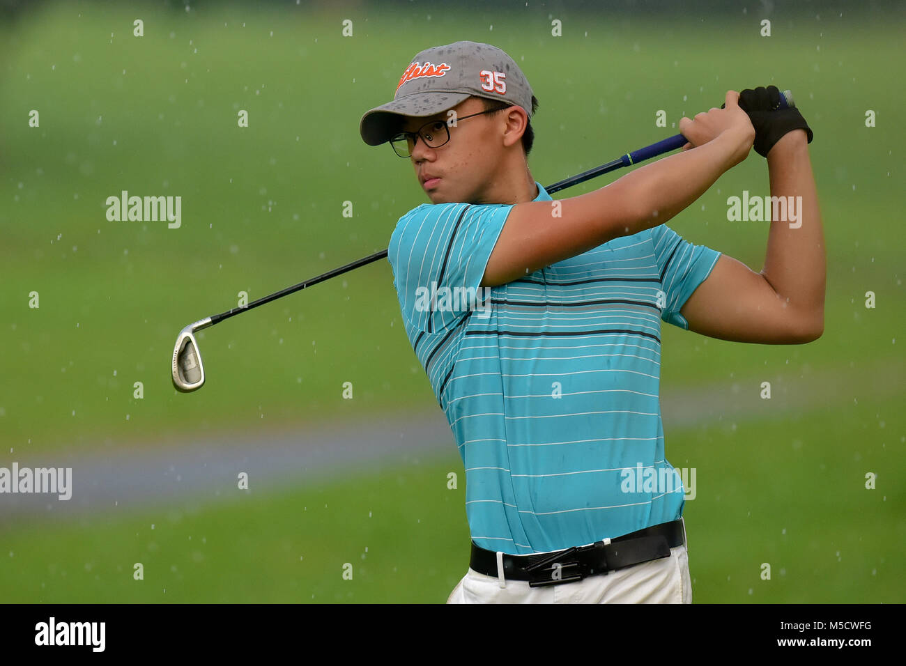 Danau, UKM Bangi - FEBRUARY 10: Joshua Lim jun Wen takes his tee shot ...