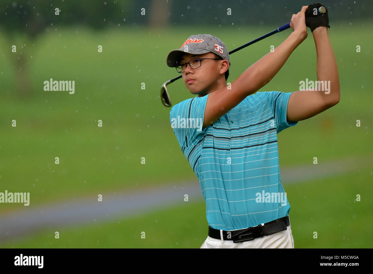 Danau, UKM Bangi - FEBRUARY 10: Joshua Lim jun Wen takes his tee shot ...