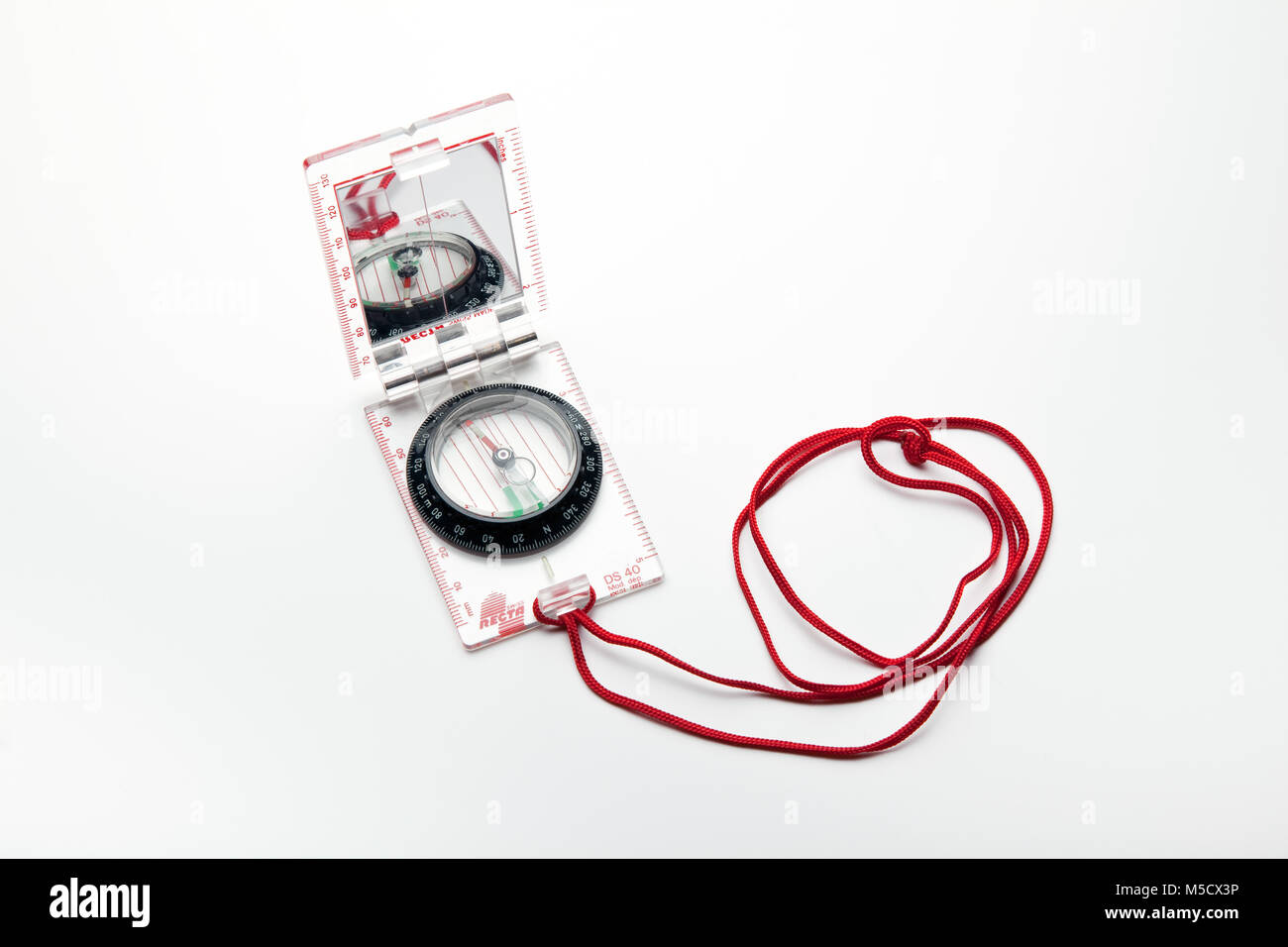 Mirror Compass with red string isolated on white background Stock Photo ...