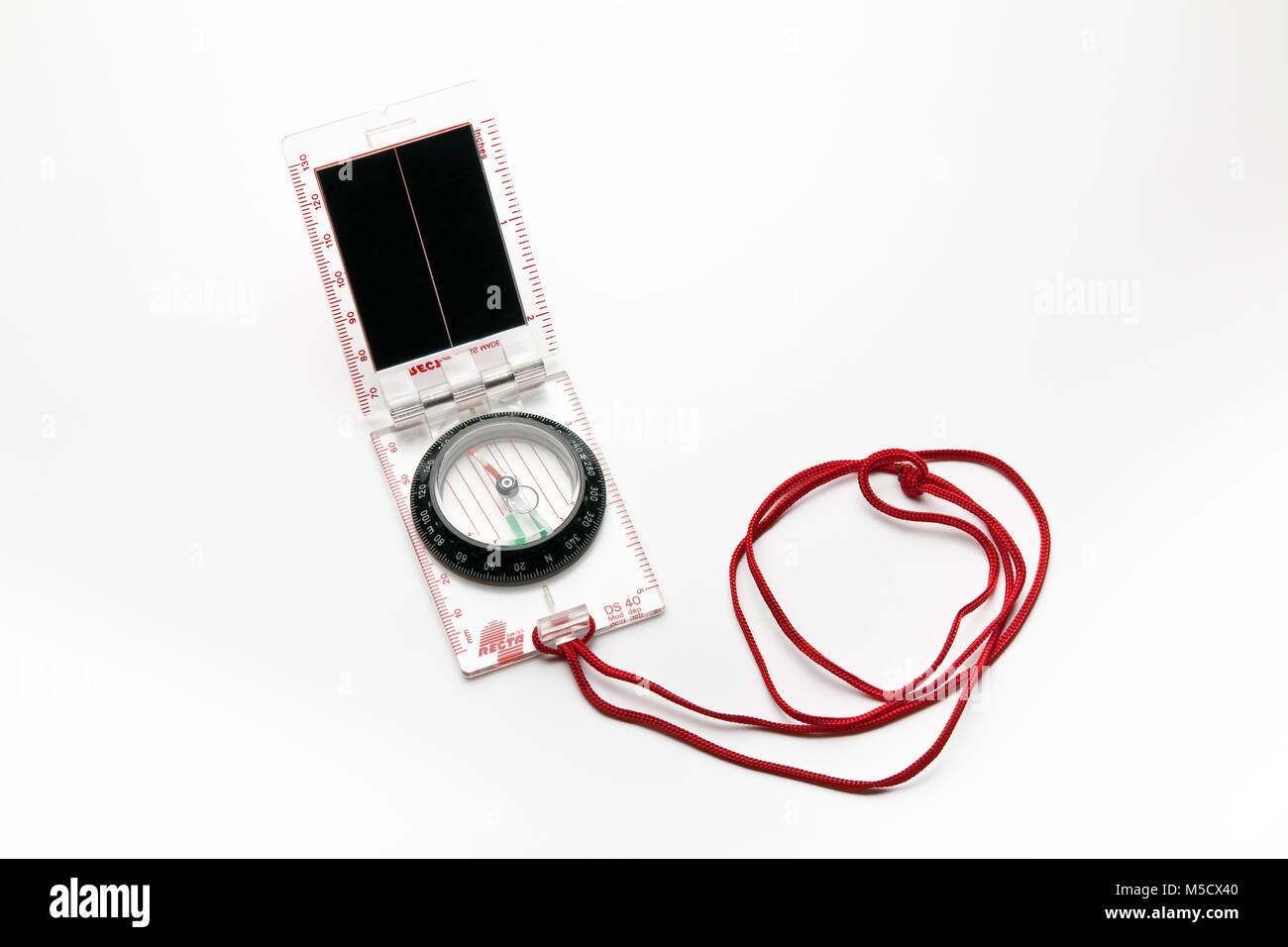 Mirror Compass with red string isolated on white background Stock Photo ...