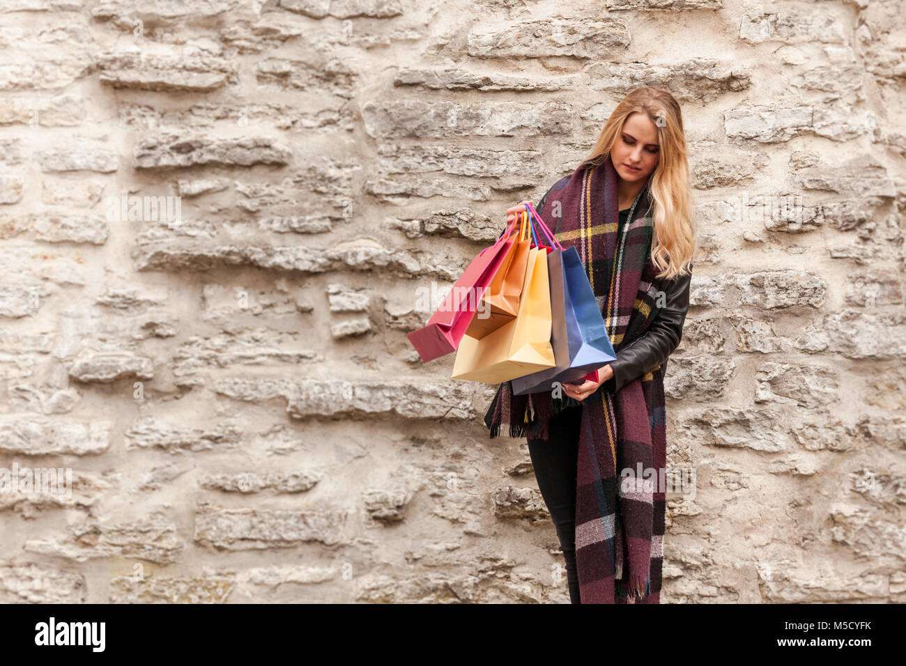 Cute model poses for shop commercial in autumn fall Stock Photo - Alamy