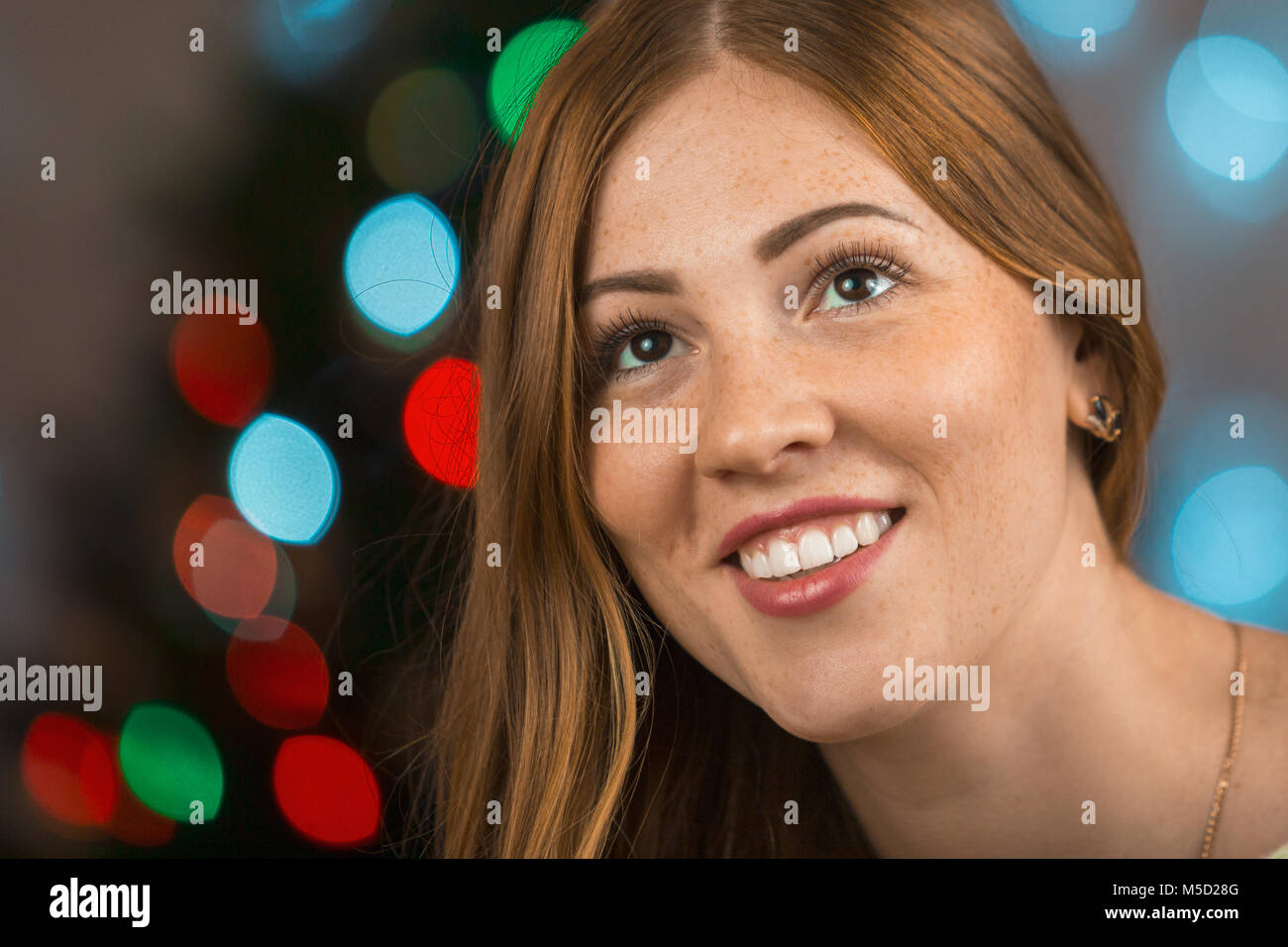 Portrait of a very beautiful smiling young woman. Female face closeup ...