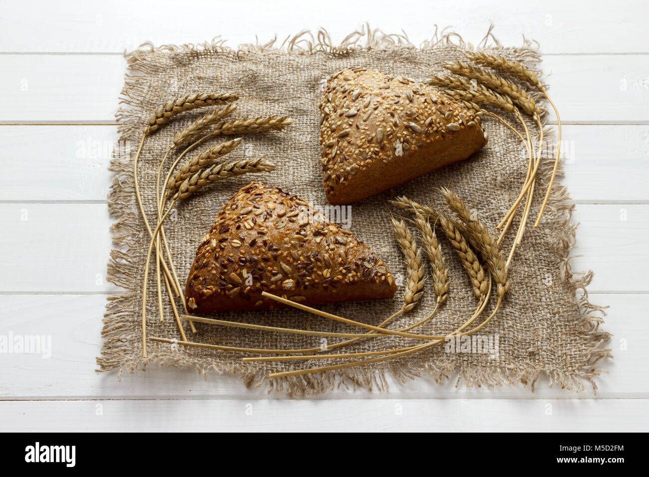 Close up rye multigrain bread on wood white baackground Stock Photo - Alamy