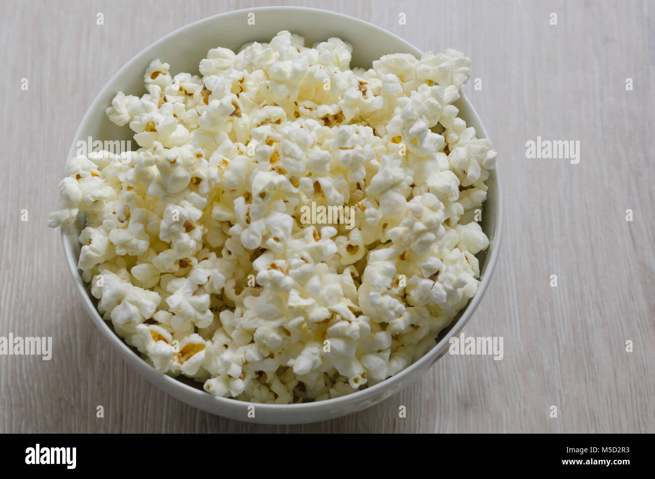 Popcorn in the bowl. Top view Stock Photo - Alamy