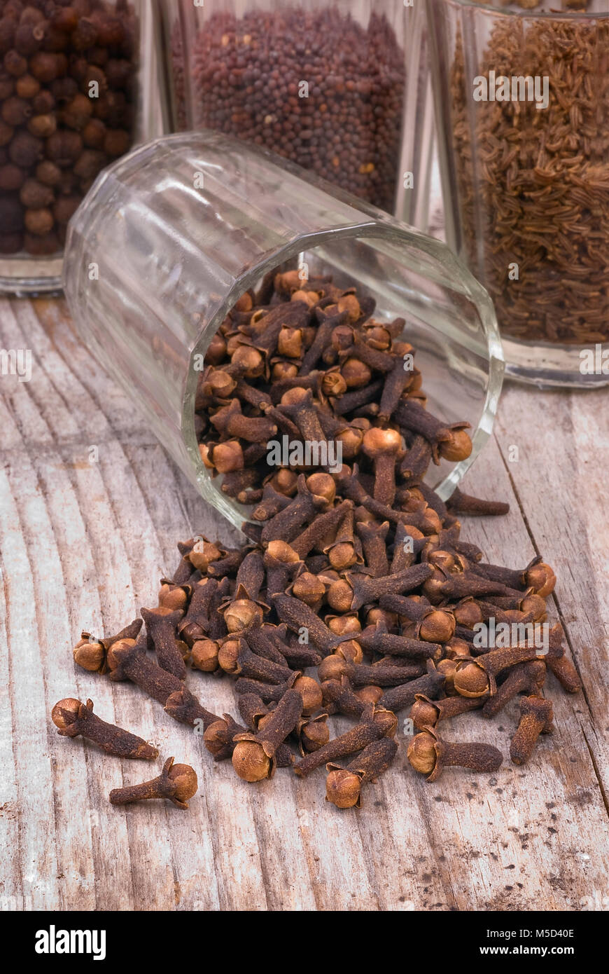 spice cloves on wood background Stock Photo - Alamy