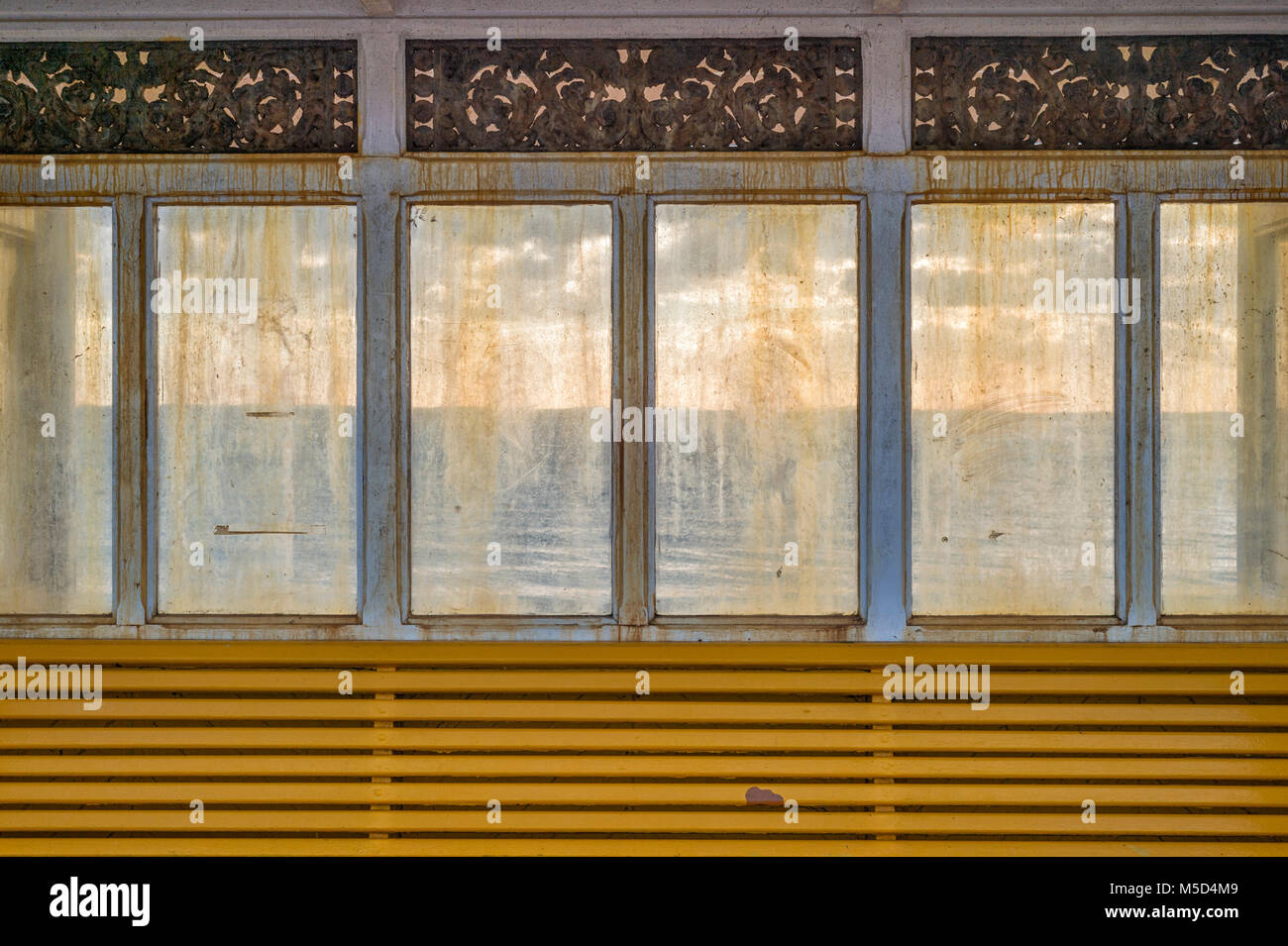 dirty windows in victorian seaside shelter Stock Photo - Alamy