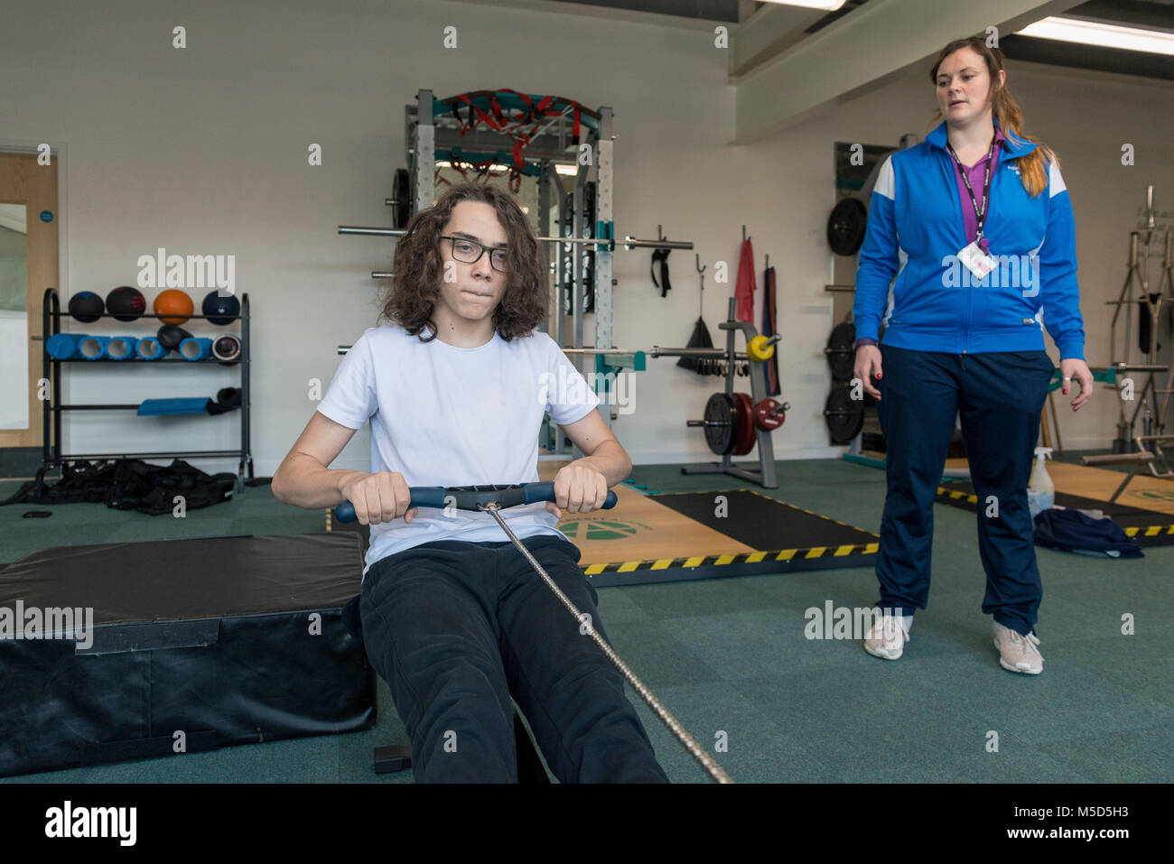 students work out and train in a gym during a lesson at college Stock ...