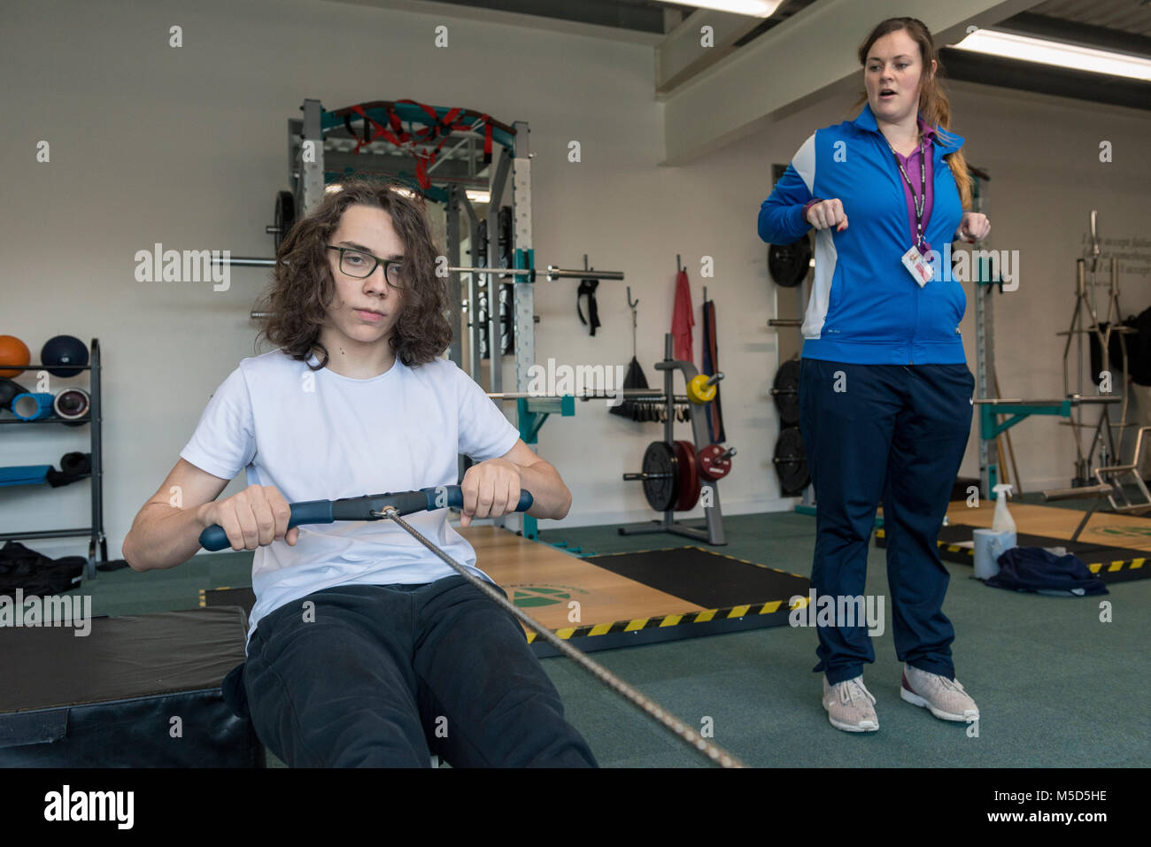 students work out and train in a gym during a lesson at college Stock ...