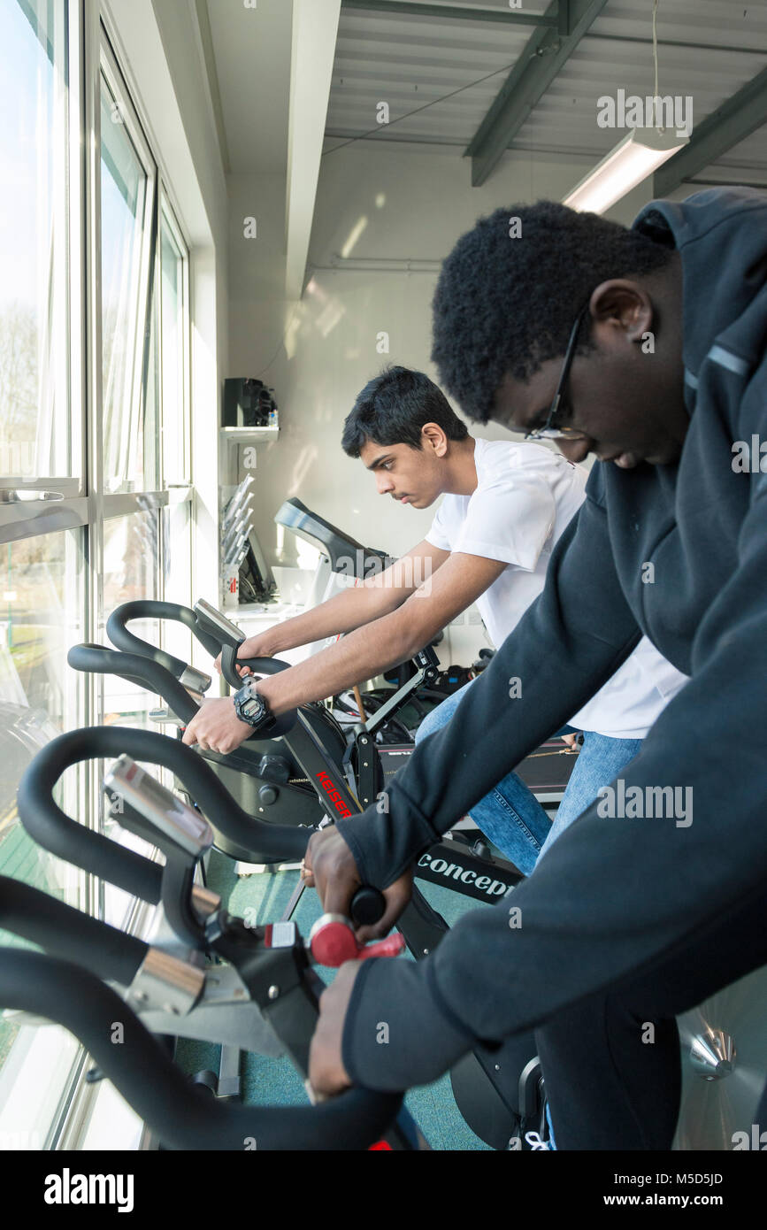 students work out and train in a gym during a lesson at college Stock ...